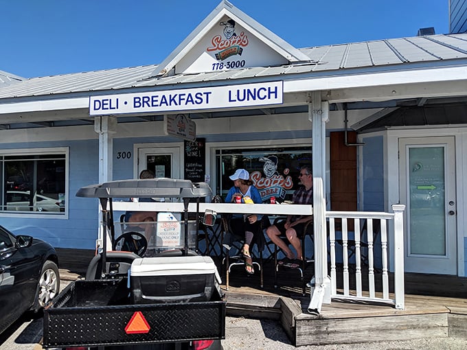 That cheerful blue exterior whispers "beach vibes" while the deli counter inside delivers serious sandwich satisfaction.