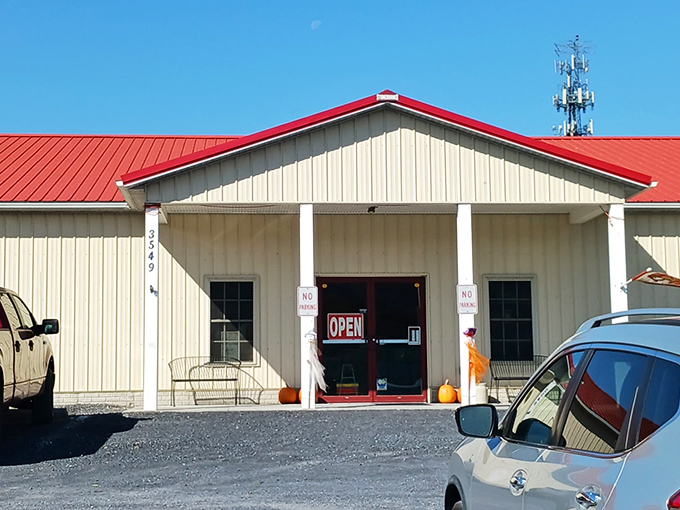 The charming red-roofed building of Shenandoah Valley Flea Market stands ready to welcome treasure hunters of all ages.