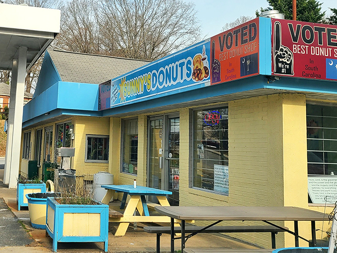 Blue skies, bright signs! Sunny's proudly displays its "Voted #1" status like a championship belt for donut dominance.