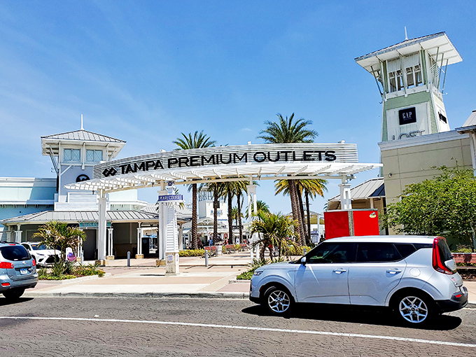 That Market Hall sign promises food, but the real feast is the deals waiting behind those palm-lined storefronts. 