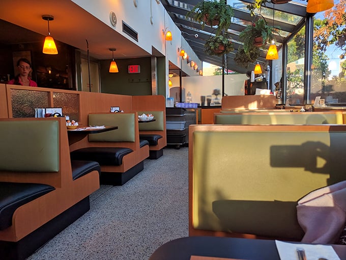 Warm booth lighting and earth tones create the perfect backdrop for serious breakfast conversations.