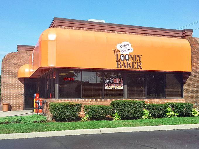 The Looney Baker's bright orange awning stands out like a delicious beacon in Livonia's morning landscape.