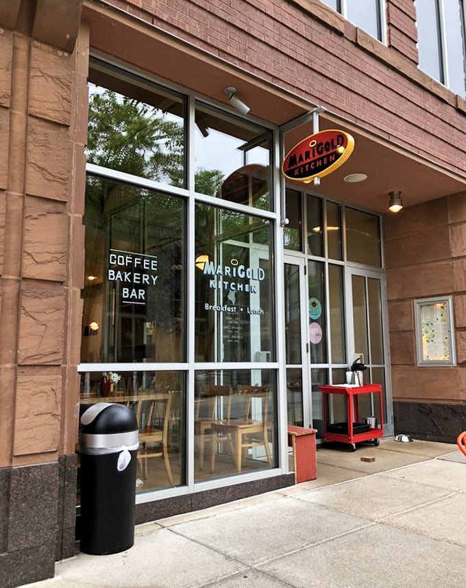Marigold Kitchen's modern storefront hides a breakfast revolution within. The "Coffee Bakery Bar" sign is basically poetry to morning people.