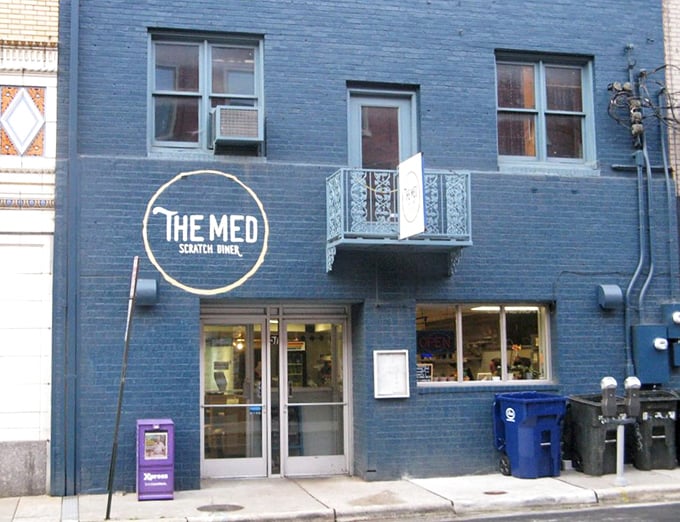 Blue brick beauty on College Street - The Med's exterior promises character-filled dining adventures ahead.