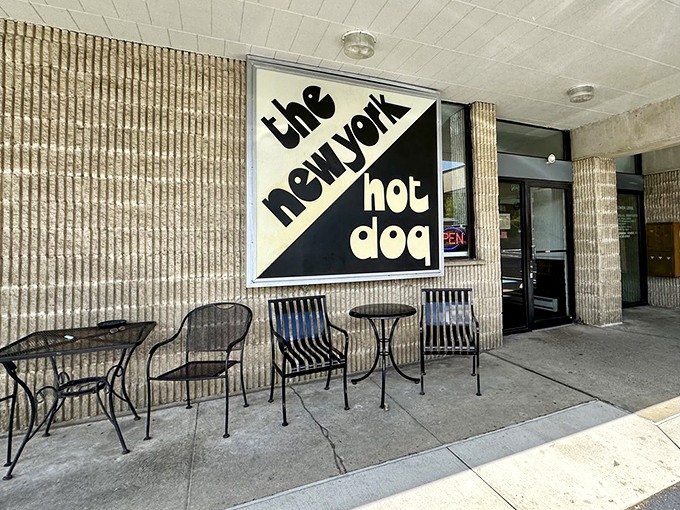 When Manhattan style meets Pittsburgh flavor. The bold black and white sign promises a hot dog experience that bridges two iconic cities in one perfect bite.