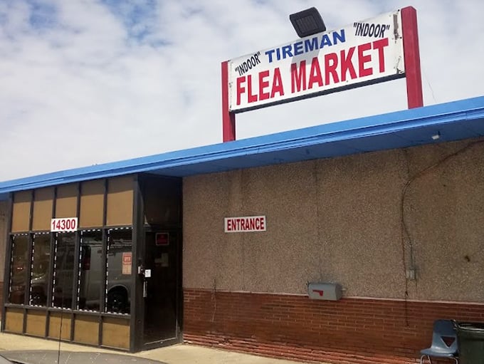 Tireman's no-frills "Indoor Flea Market" sign tells you exactly what you need to know&mdash;authentic urban bargain hunting awaits inside.