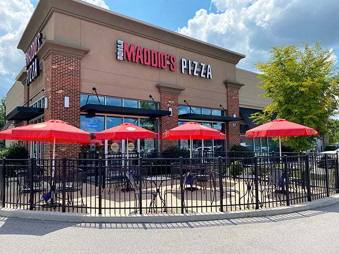 Uncle Maddio's modern storefront promises pizza personalization. Those red umbrellas aren't just for show&mdash;they're for pizza enjoyment.