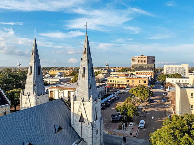 Victoria's skyline rises from the coastal plains, proving that twin church spires can still guide a community forward.