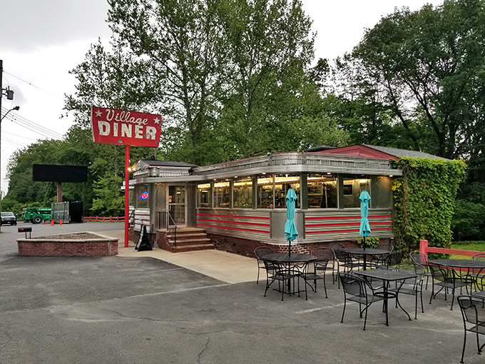 The Village Diner glows like a beacon for hungry souls seeking real comfort food in Milford.