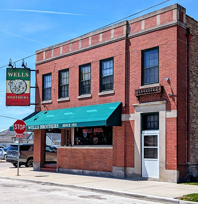 The green awning whispers "family recipes inside" to those who know where to look.