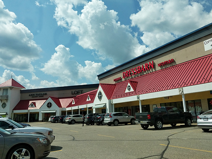 Classic outlet charm where red roofs shelter amazing deals and friendly faces welcome every bargain hunter.