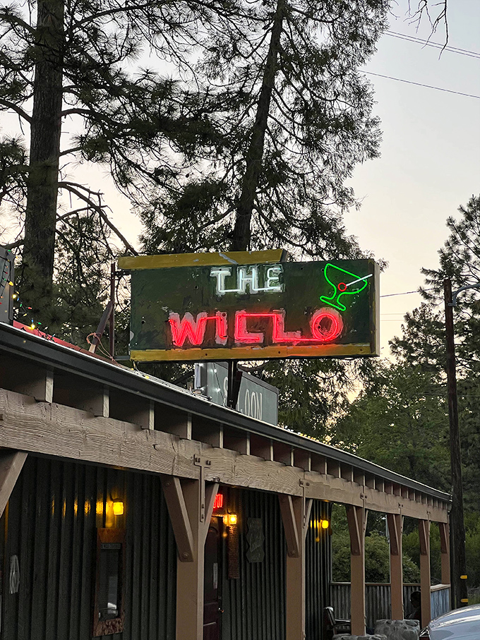 That neon glow promises old-school steakhouse magic hidden among the Sierra Nevada pines and towering trees.