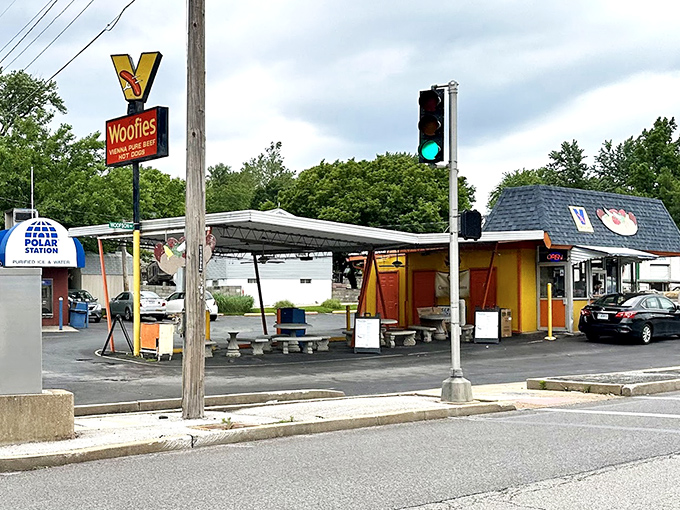 That bright yellow sign isn't just advertising - it's practically a beacon calling all hot dog lovers home.