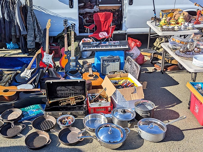 Musical instruments and cookware share space at Alameda Point Antiques Faire. One person's extras become another's essentials!