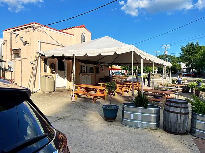 That white tent means business; outdoor dining where the smoke and flavor take center stage perfectly.