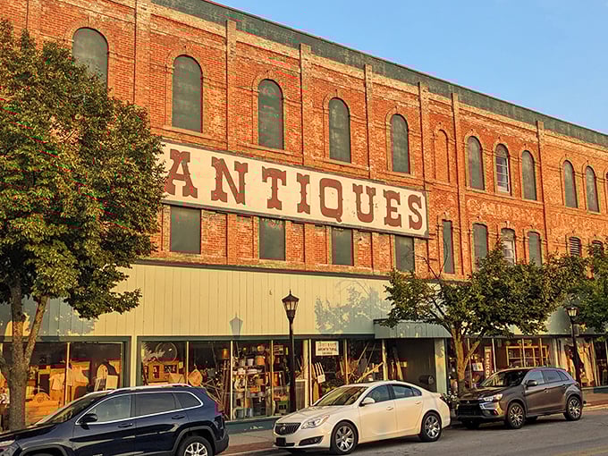 The "Antiques" sign painted on brick tells you serious collectors have gathered their best finds.