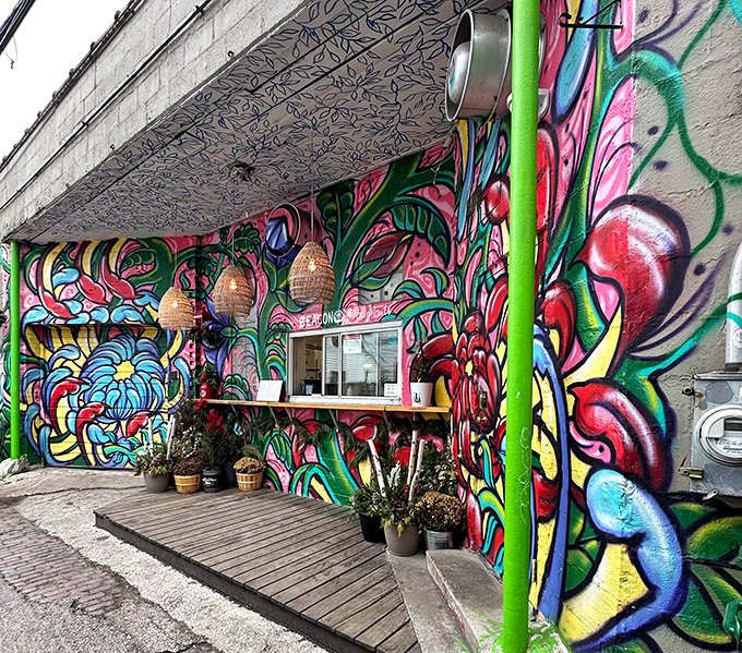 Street art meets sweet art in this vibrant wonderland that makes choosing donuts feel like gallery browsing.