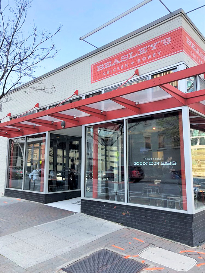 Modern meets timeless here, where glass windows reveal the ancient art of perfect fried chicken.