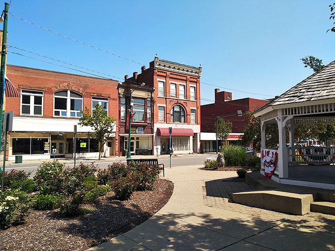 Downtown Bradford blends charm and history, where a stately brick building with ornate details overlooks a gazebo-lined square.