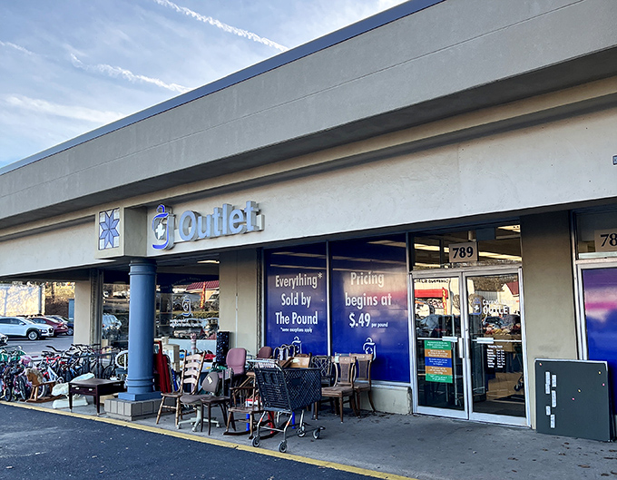 Blue skies and blue signs&mdash;a perfect match at Care & Share's storefront. Their per-pound pricing system turns shopping into a delightful game show.