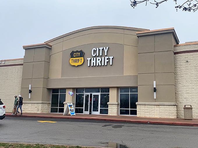 The City Thrift entrance welcomes savvy shoppers to the treasure hunt. Two people heading in are about to experience the thrill of the unexpected find.
