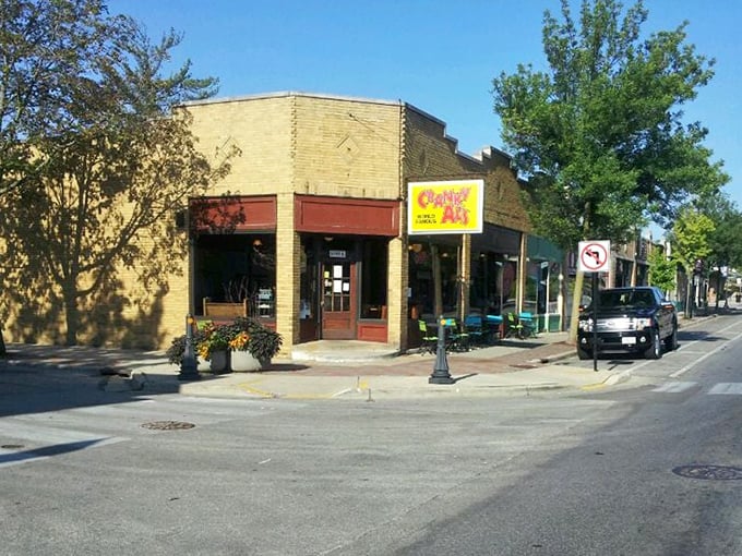 Corner locations often hold the best secrets, and this sunny yellow sign promises sweet discoveries around every bend.