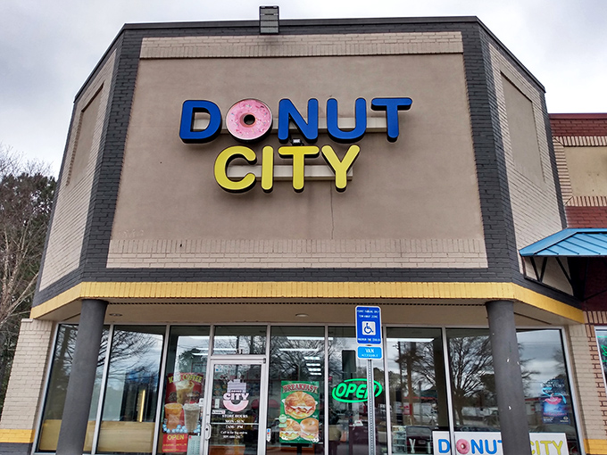 The "OPEN" sign at Donut City might as well say "Yes, you deserve this." Sometimes the simplest storefronts hide the sweetest treasures.