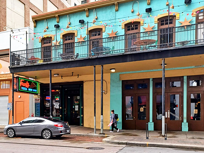 That turquoise facade promises big flavors and even bigger slices waiting inside.