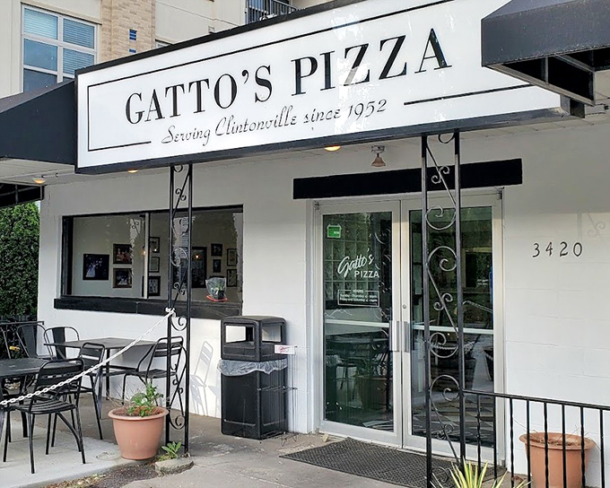 Those elegant iron details hint at the old-world craftsmanship happening inside this pizza sanctuary.