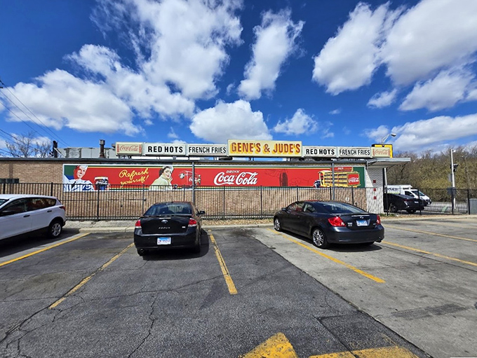 The faithful gather at this legendary stand where french fries meet hot dogs in perfect harmony.
