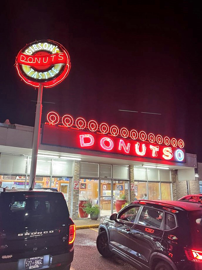 That iconic red glow promises sweet satisfaction - a beacon of hope for donut lovers citywide.