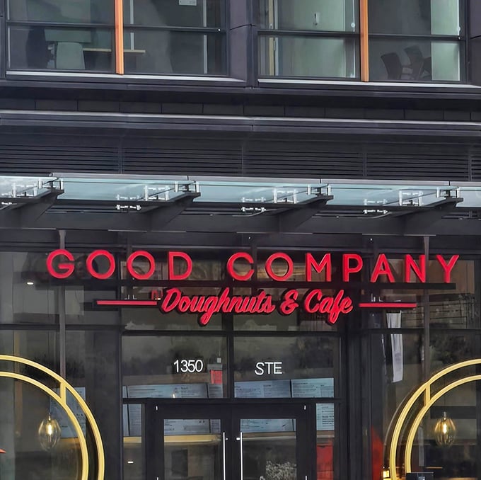 Those colorful donut displays in the window are like edible stained glass - pure temptation on display.