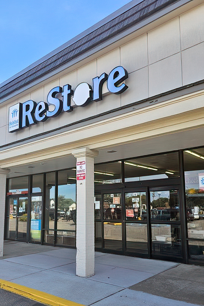 The ReStore sign glows like a beacon for bargain hunters. Where one person's donations become another's delightful discoveries.