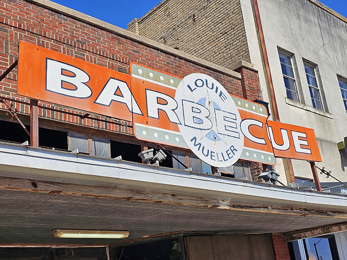 That orange "BARBECUE" sign isn't just advertising&mdash;it's a beacon of hope for hungry travelers on Texas highways.