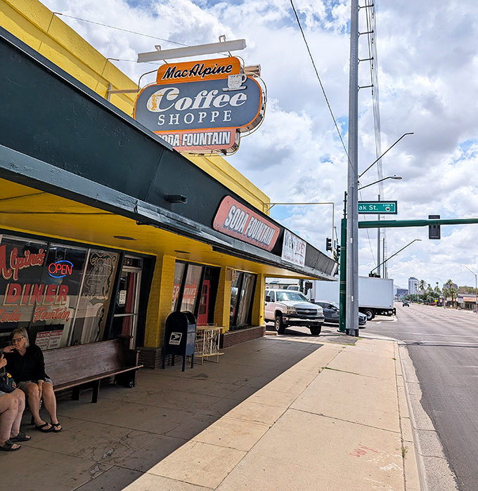 The classic soda fountain vibe at MacAlpine's promises milkshakes thick enough to require serious straw commitment.