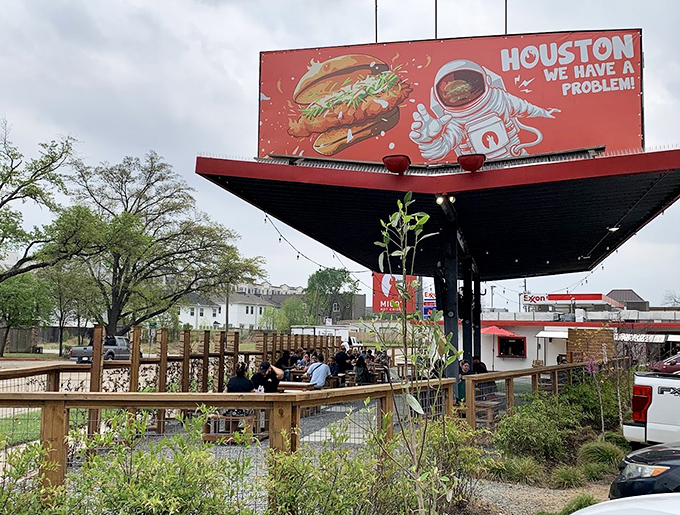 That covered patio setup means you can sweat from the spicy chicken, not the Texas sun.