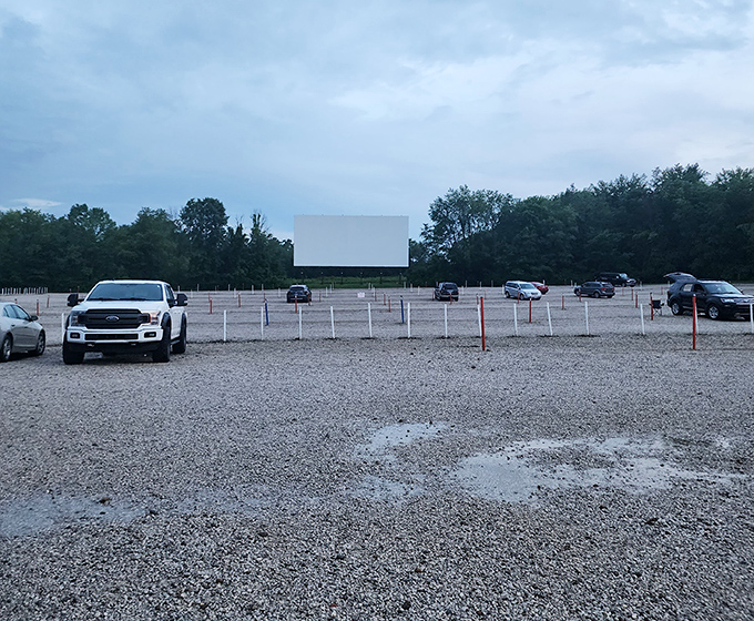 Gravel paths lead to movie magic where every parking spot offers front-row entertainment value.