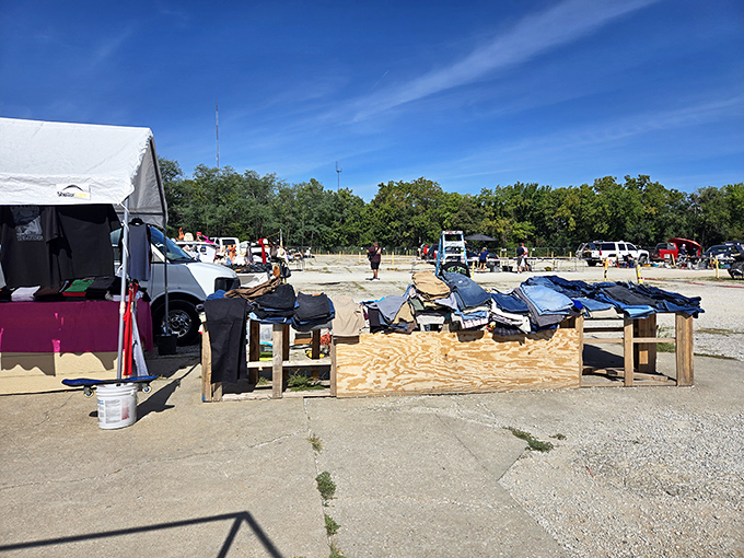 The outdoor market buzzes with activity and possibility. Tables loaded with merchandise stretch as far as the eye can see.