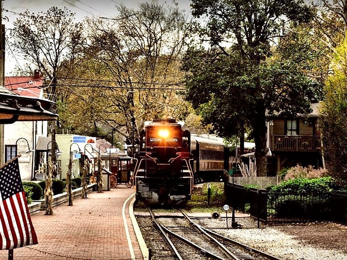 A vintage train rolls into New Hope&rsquo;s station, where brick walkways, historic charm, and small-town warmth welcome travelers.
