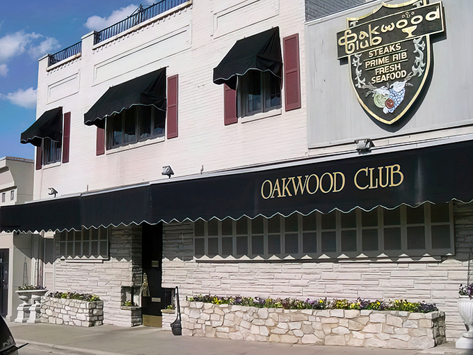 Classic white brick and black awnings &ndash; the Oakwood Club dresses better than most of its customers, and we're okay with that.