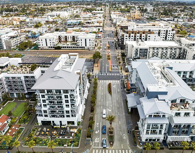 Modern coastal living with palm trees standing at attention, as if saluting your wise decision to move here.