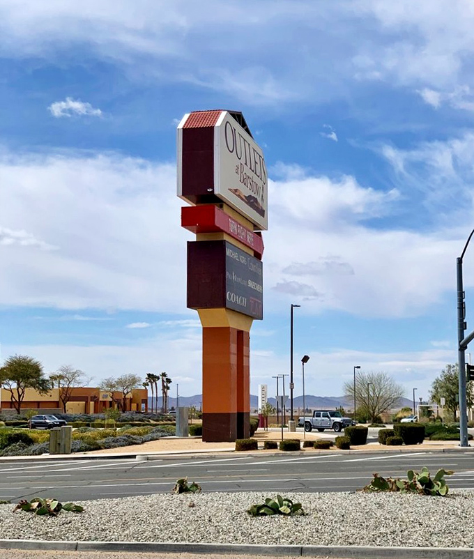 San Francisco Premium Outlets sign standing tall, like a beacon calling all deal-seekers to retail paradise.