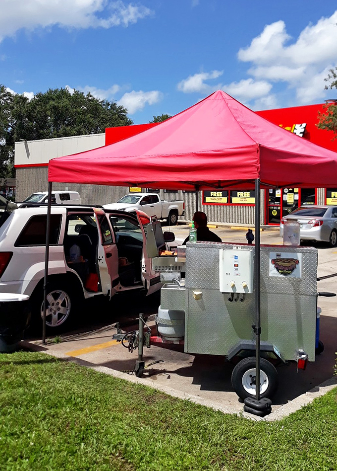 The mobile setup means fresh grilled dogs can appear anywhere, bringing Colombian-style flavors right to your corner.