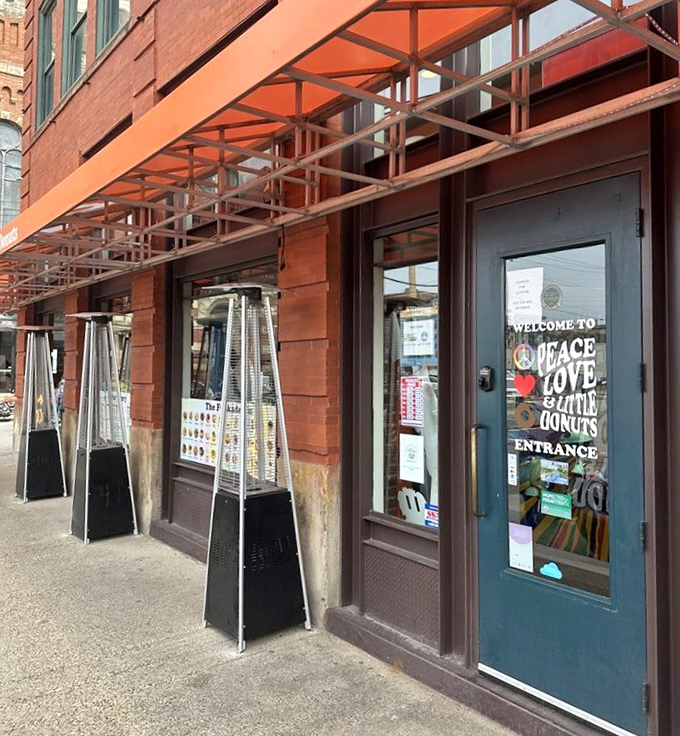 That orange awning beckons like a beacon of sugary salvation in the urban landscape.