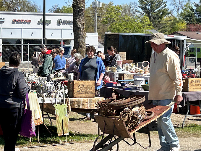 Rustic charm meets practical shopping where old wheelbarrows carry new dreams and endless possibilities.