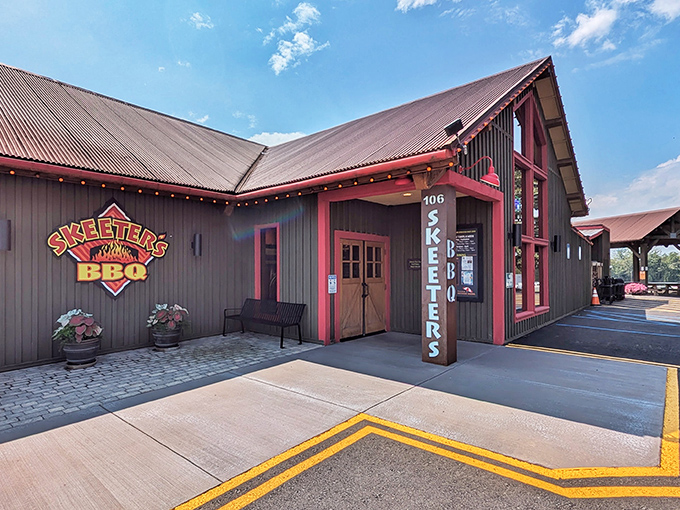 That barn-style building practically screams "authentic smokehouse" from every weathered wooden board.