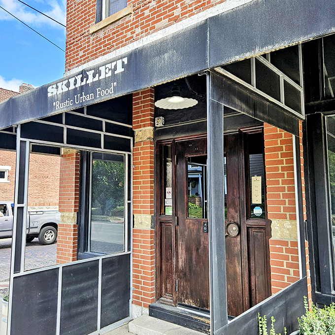 Rustic charm meets urban sophistication where brick and wood create the perfect breakfast backdrop.