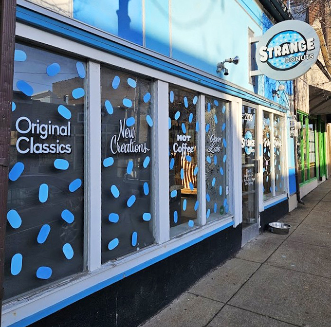 The blue-dotted windows at Strange Donuts hint at the delightfully odd creations waiting inside.