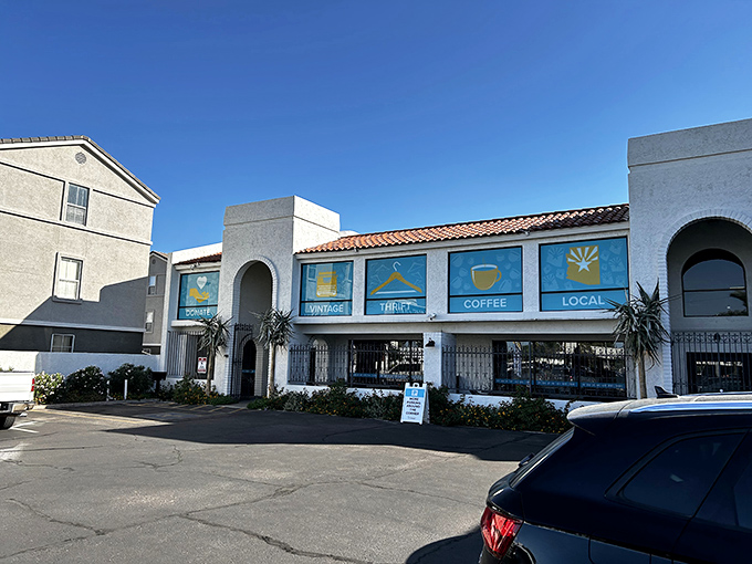 Those cheerful blue signs advertising "Donate," "Vintage," and "Coffee" are basically the thrifter's version of "Eat, Pray, Love."