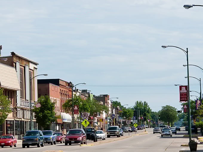 Main street stretches ahead like a welcome mat for budget-conscious shoppers and diners.